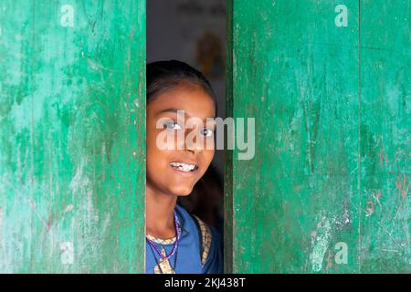 School girl peeping from a classroom Stock Photo - Alamy