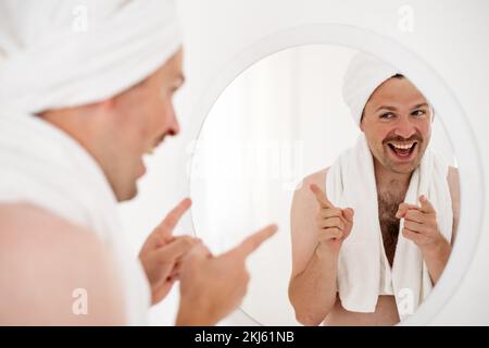 young man trying to cheer himself up before a first date Stock Photo ...
