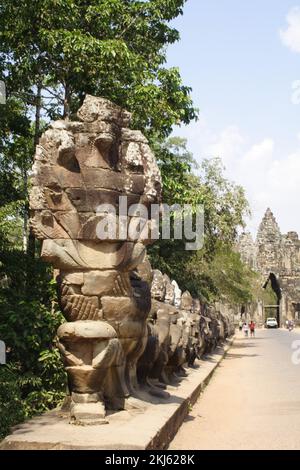 Naga and gods lining the causeway, Southern Gate, Bayon temple, Angkor ...