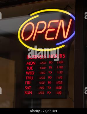 Welcome Back Neon Sign on a red brick wall Stock Photo - Alamy