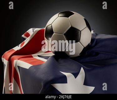 A regular soccer balls resting on an Australia flag draped over a ...