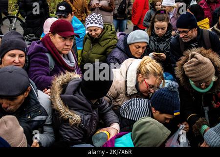 Residents of Kherson, Ukraine, receive food supplies in Freedom Square ...