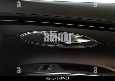 Modern car interior door handle close up. Metallic Car door opener ...