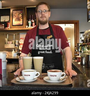 Indoor Portrait Of A Costa Coffee Worker Making Drinks For Customers ...