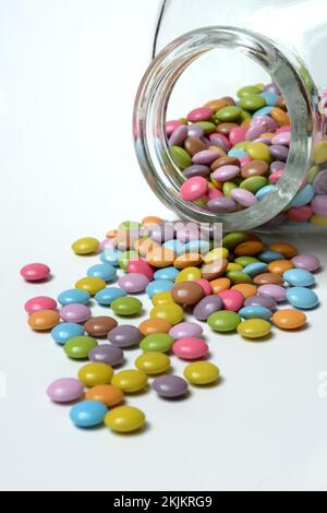 Chocolate lentils with glass container, Smarties Stock Photo - Alamy