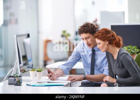 Hes always happy to help. a handsome businessman in his office Stock ...