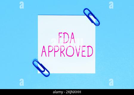 Sign displaying Fda Approved, Word for FDA agreed the product or ...