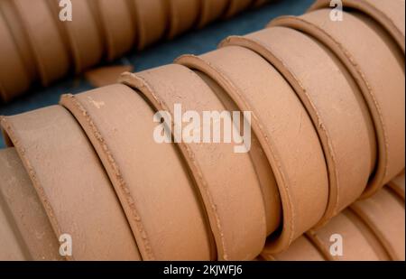 A stack of unpainted clay pots Stock Photo - Alamy