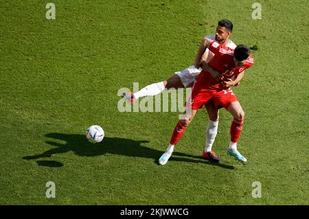 Wales' Kieffer Moore battles with Iran’s Milad Mohammadi during the ...