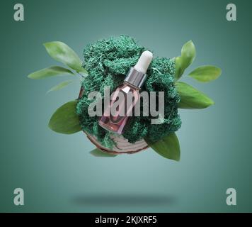 Cosmetic dropper bottle with green moss, cucumber and rocks on color ...