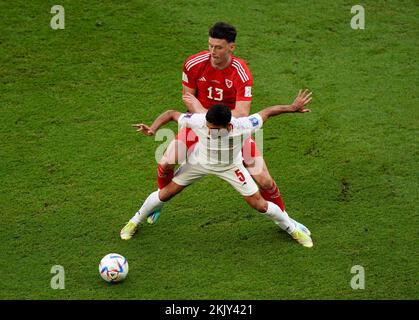 Wales' Kieffer Moore battles with Iran’s Milad Mohammadi during the ...