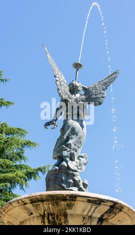 A vertical shot of an angel statue fountain in the park Stock Photo - Alamy