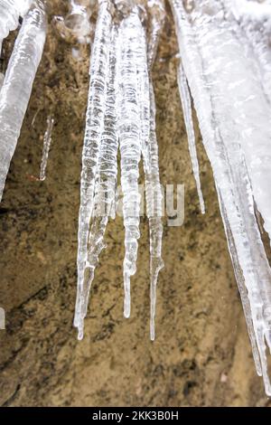 Icicles crystal on the frozen stone. Outdoor and winter Stock Photo - Alamy