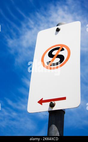 sign with no parking anytime against vibrant blue sky Stock Photo - Alamy