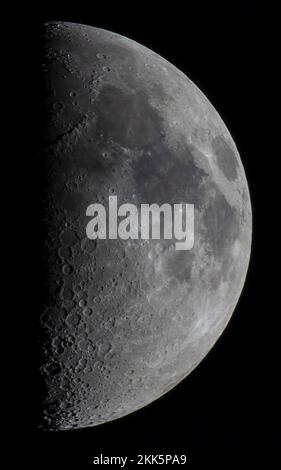 A scenic zoomed-in shot of the moon in the night sky Stock Photo - Alamy