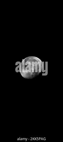 A scenic zoomed-in shot of the moon in the night sky Stock Photo - Alamy