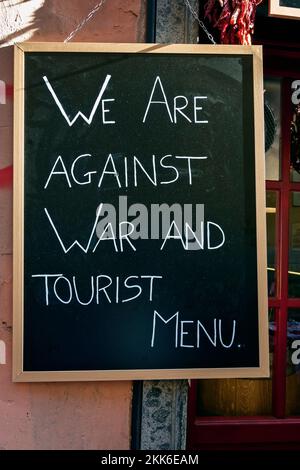 We are against war and tourist menu. Concept ironic peace message ...