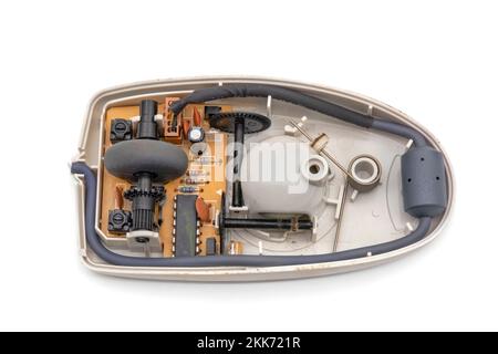 Interior of a mechanic computer mouse, with its ball and microchips ...