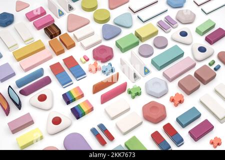 various shapes and colors of erasers arranged isolated on white ...