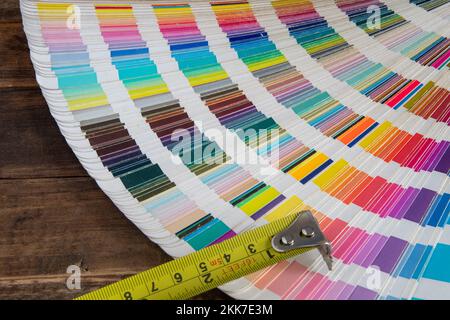 Sampler of colors used in graphic arts, on a wooden table Stock Photo ...