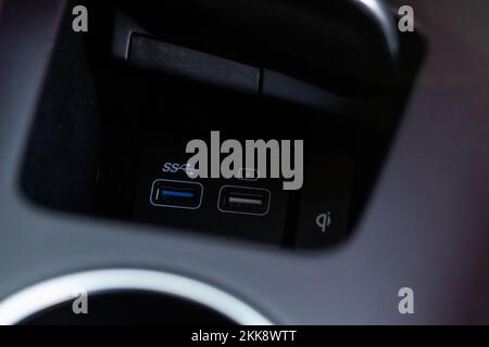 Opened car USB port in the car for connecting device. Power output of ...