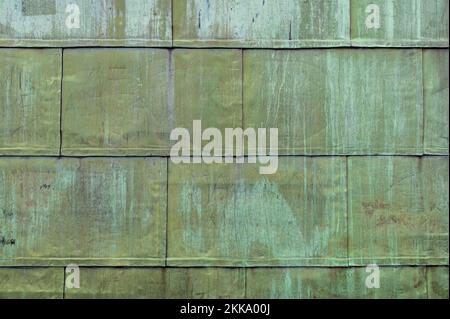Oxidized copper folded sheet metal on roof. Copper wall texture ...