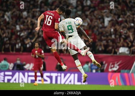 Khalid Muneer of Qatar Iliman Ndiaye of Senegal during Qatar v Senegal ...