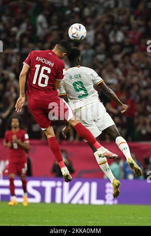 Khalid Muneer of Qatar Iliman Ndiaye of Senegal during Qatar v Senegal ...