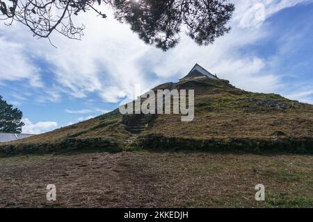 megalithic grave mound named Saint-Michel tumulus near Carnac, a ...