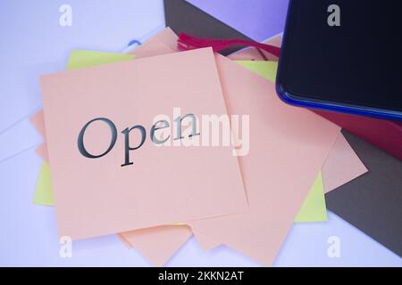Open. Text on adhesive note paper. Event, celebration reminder message ...