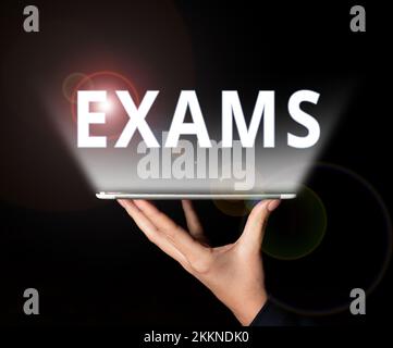 Hand writing sign Exams. Business concept test of a specified kind to ...