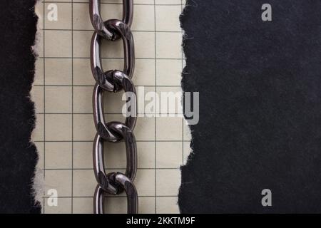 Chain and torn paper on a dark background Stock Photo - Alamy