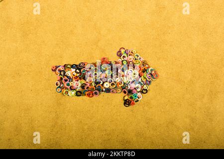 Arrow sign cut out of brown paper on piece of wood Stock Photo - Alamy