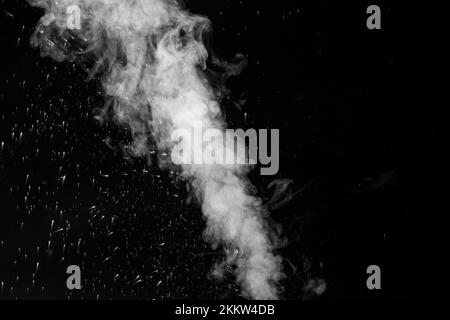 A jet of hot steam with splashes. The movement of hot steam with water ...