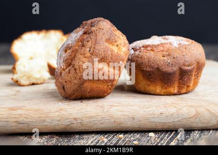 fresh cottage cheese cupcake on a wooden table, delicious soft homemade ...