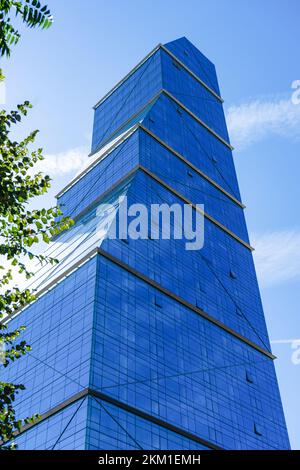 Glass skyscraper in Tbilisi's downtown on the blue sky background Stock ...