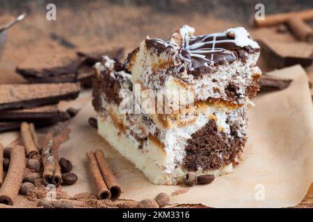 a multi layered cake made of chocolate and cream cakes in a chaotic ...