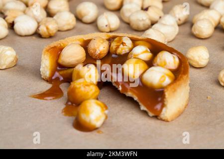 tartlet with salted caramel and hazelnuts, round tartlet with soft ...