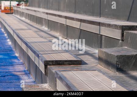 Seating area for spectators made with composite deck next to the tennis ...