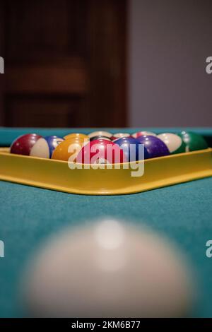 View of Ballard's balls with a cue ball and green Baize-covered table ...