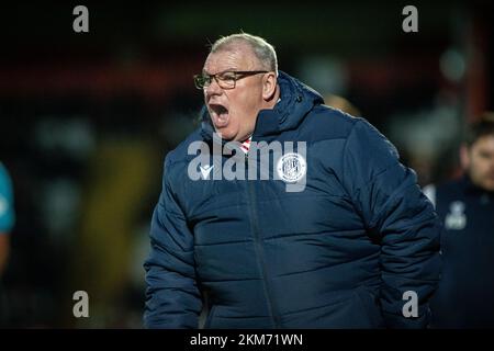 Football manager Steve Evans standing on touchline during game whilst ...