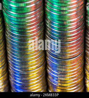 a large number of coins lying together, metal coins of different ...