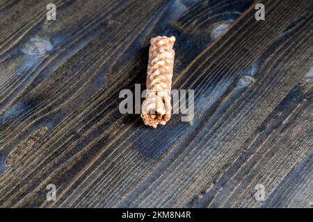 thin crispy waffles lie on a black table, sweet food for desserts Stock ...