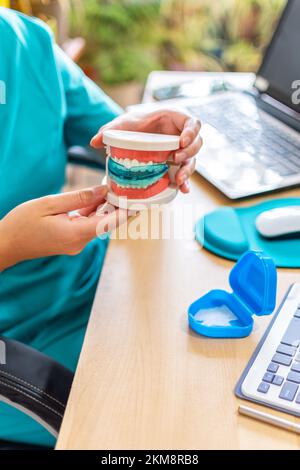 A vertical shot of a dentist consultation, dental brace, or teeth ...