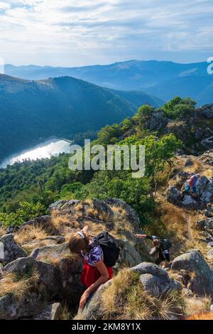 Vosges (Vogesen) Mountains: rocks Spitzkoepfe at summit Hohneck, hiker ...