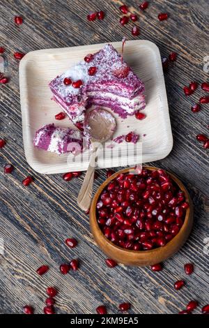 a maroon colored cake with the taste of different berries and a creamy ...