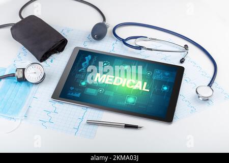 Tablet pc and medical stuff Stock Photo - Alamy