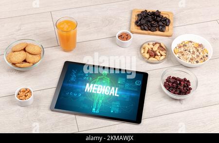 Tablet Pc with fruits, medical concept Stock Photo - Alamy