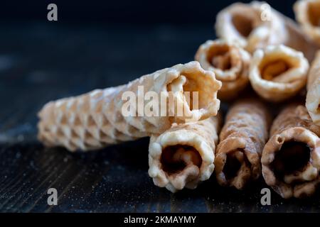 waffle tubes made of wheat flour, eggs and sugar, sweet dessert waffle ...
