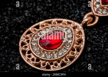 Photo of golden set with gems over dark background Stock Photo - Alamy
